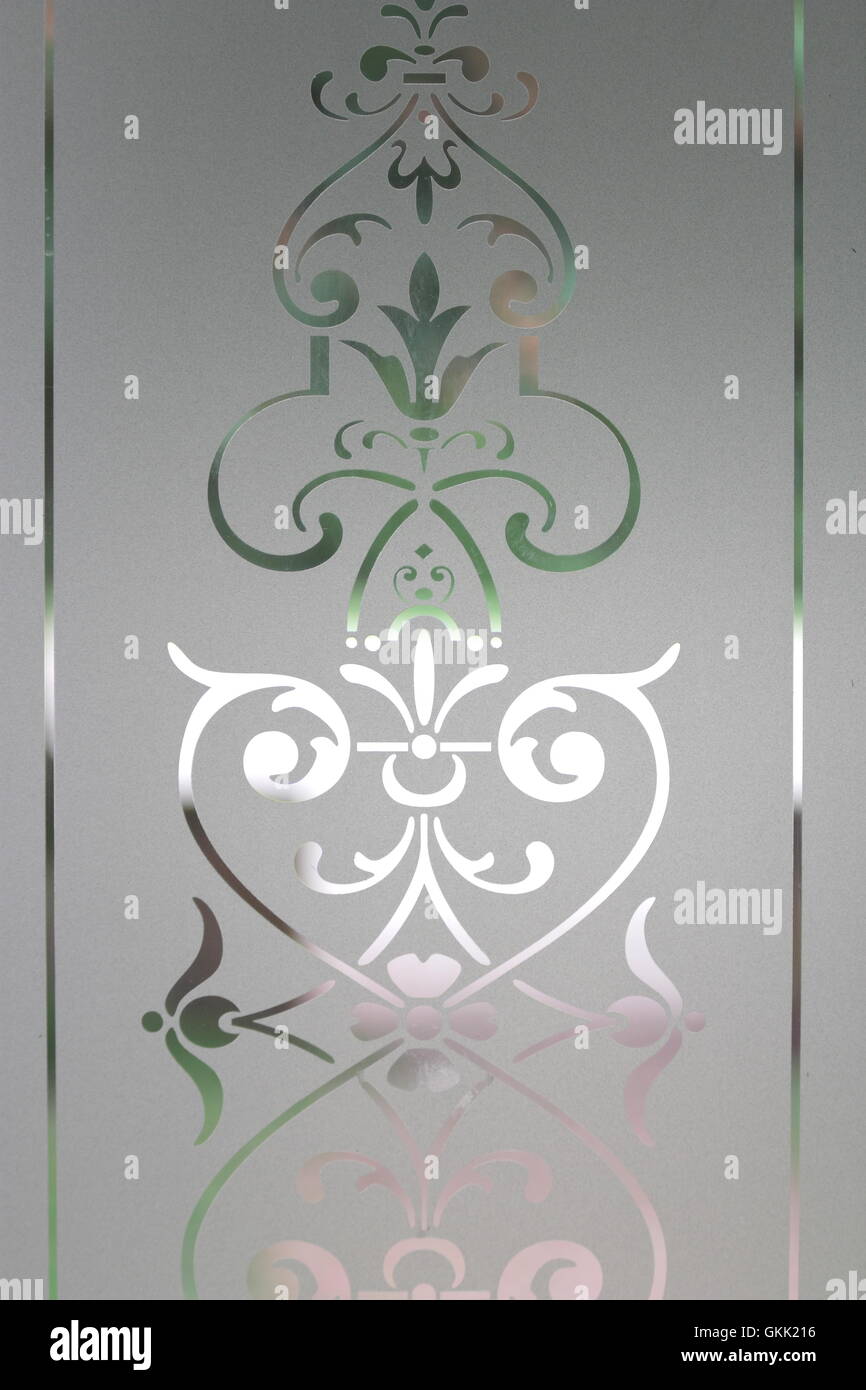 Frosted patterned window with curves Stock Photo - Alamy