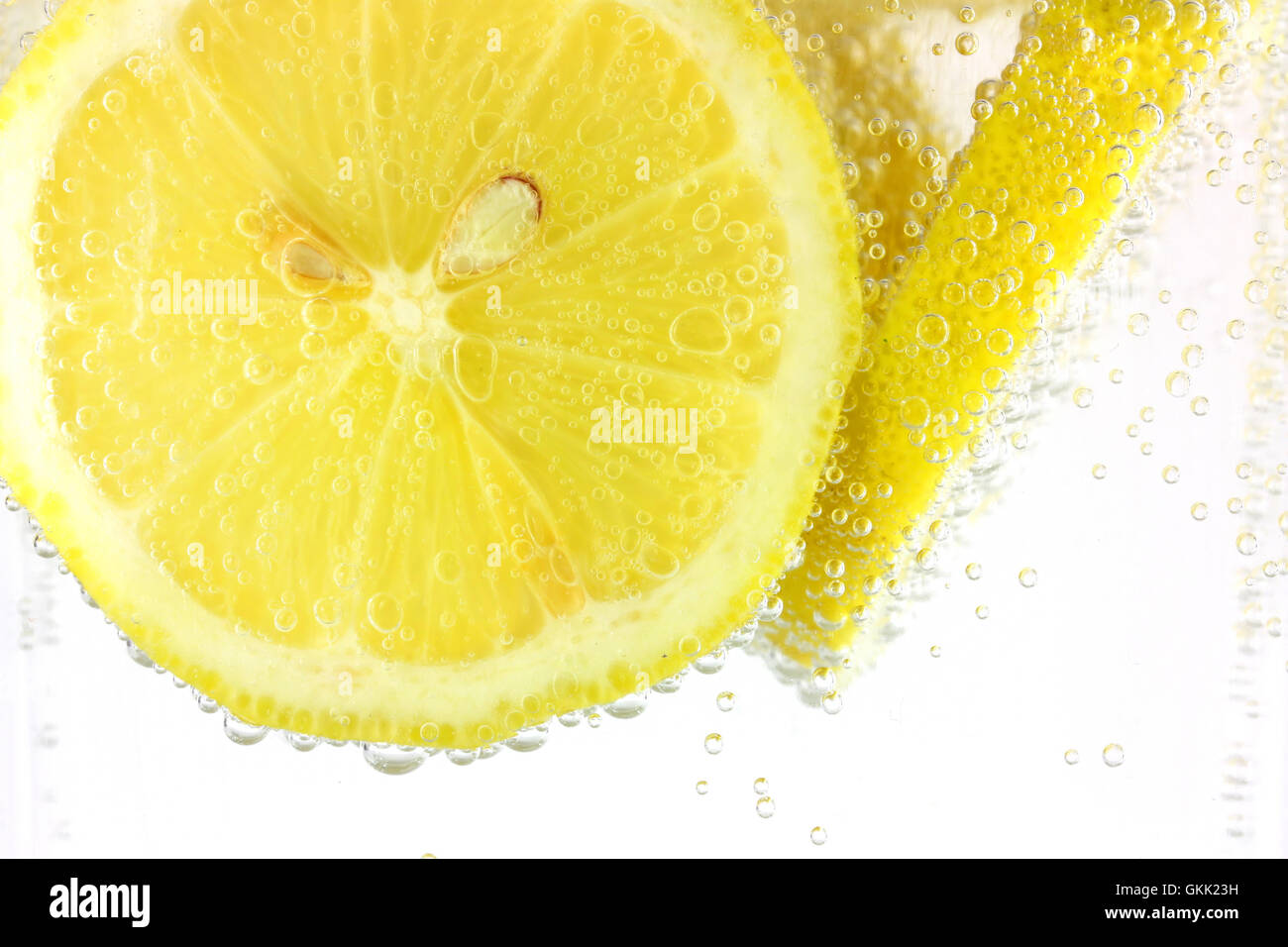 Sliced lemon in refreshing fizzy water Stock Photo - Alamy