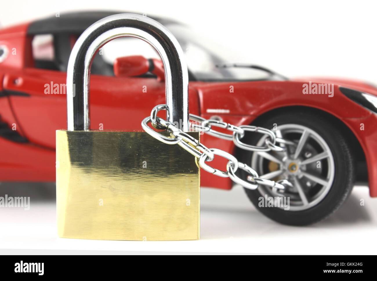 Vehicle security with padlock and chain on wheel and a white background ...
