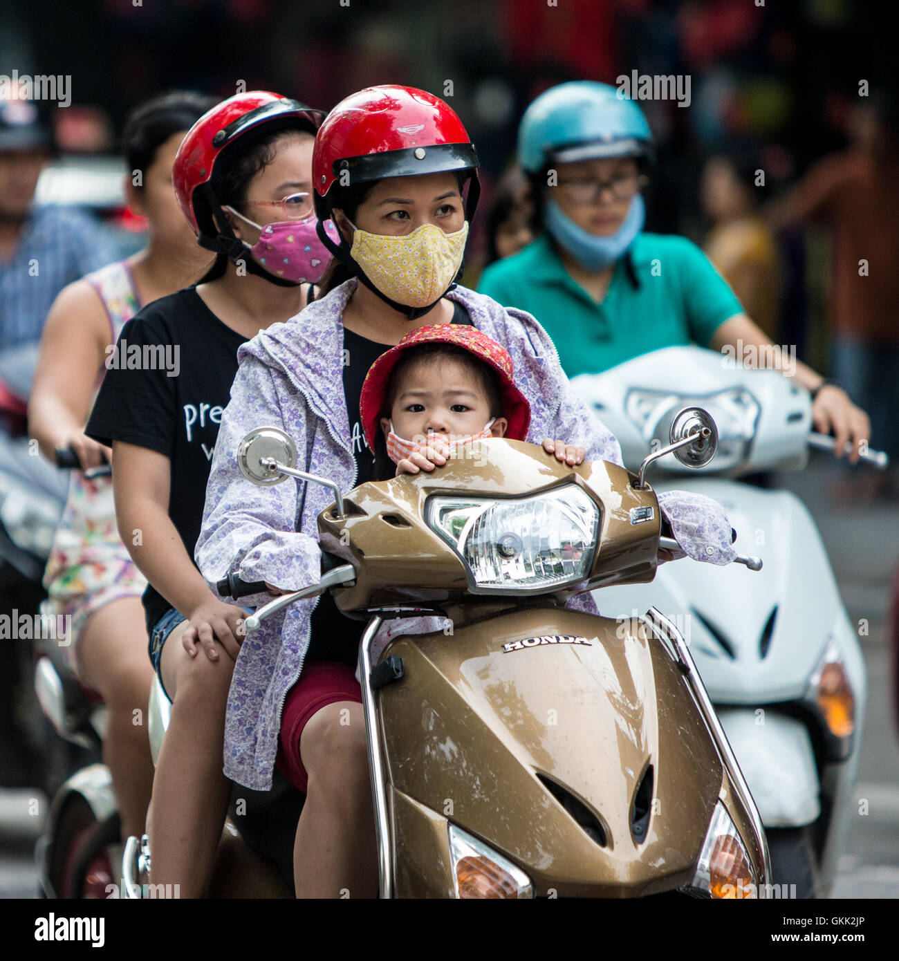 Vietnamese Moped Motorcycle Motorbike Riders on the streets of Hanoi in ...