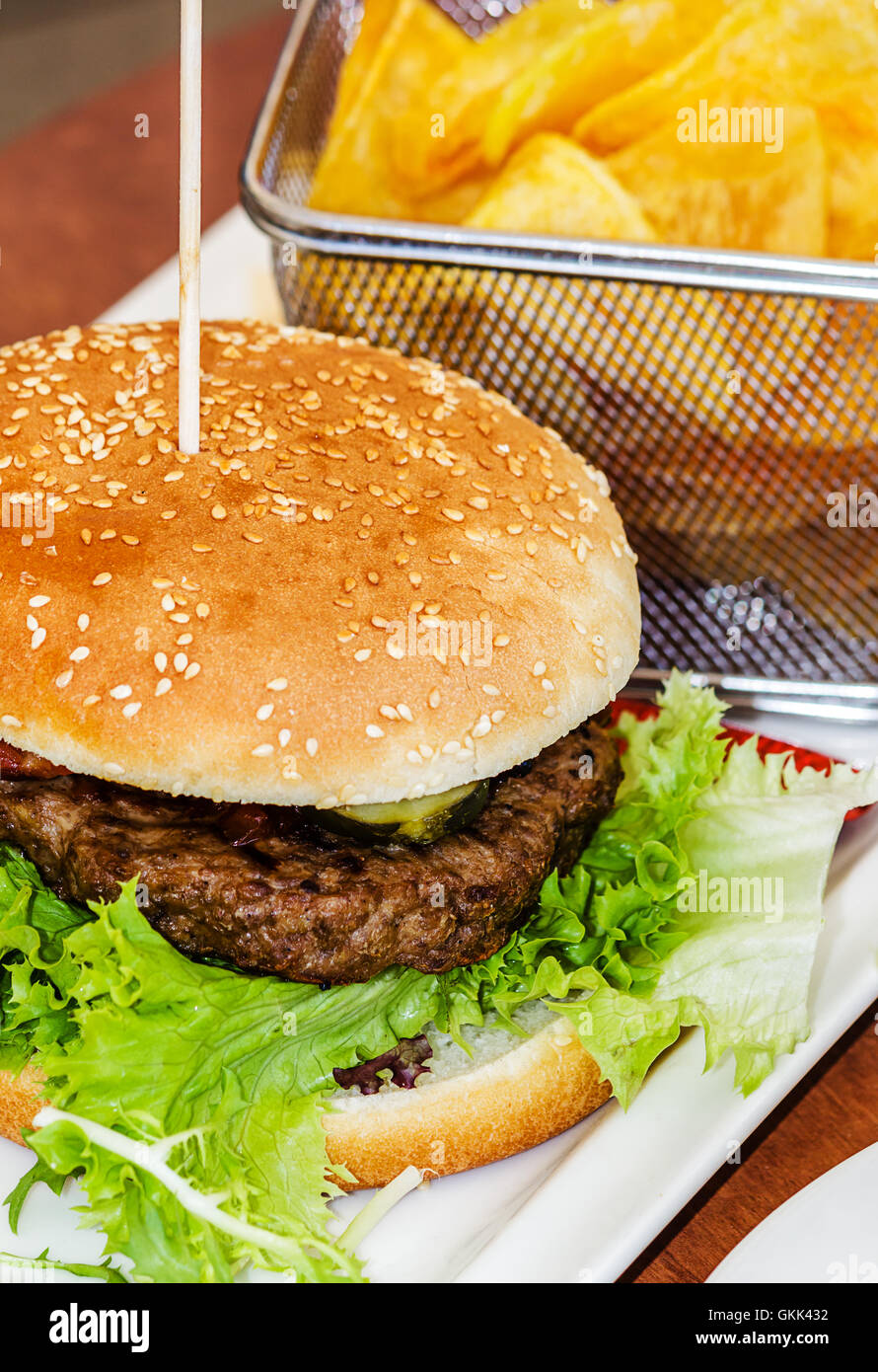 Fresh burger with homemade chips Stock Photo - Alamy