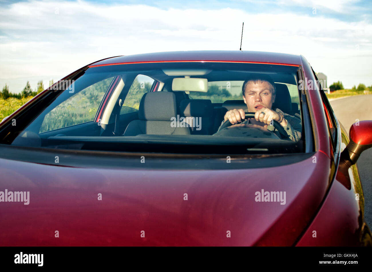 Drunk man driving a car Stock Photo - Alamy
