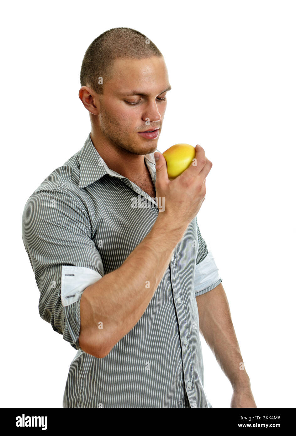 Man eating an apple. Isolated on white Stock Photo - Alamy