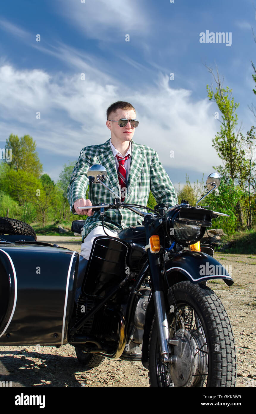 Classy guy on a motorcycle with a sidecar Stock Photo - Alamy