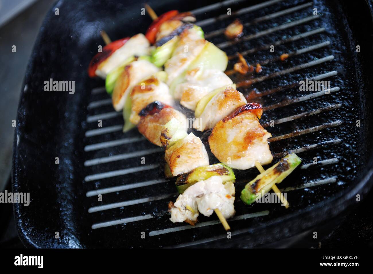 tasty meat on stick Stock Photo - Alamy