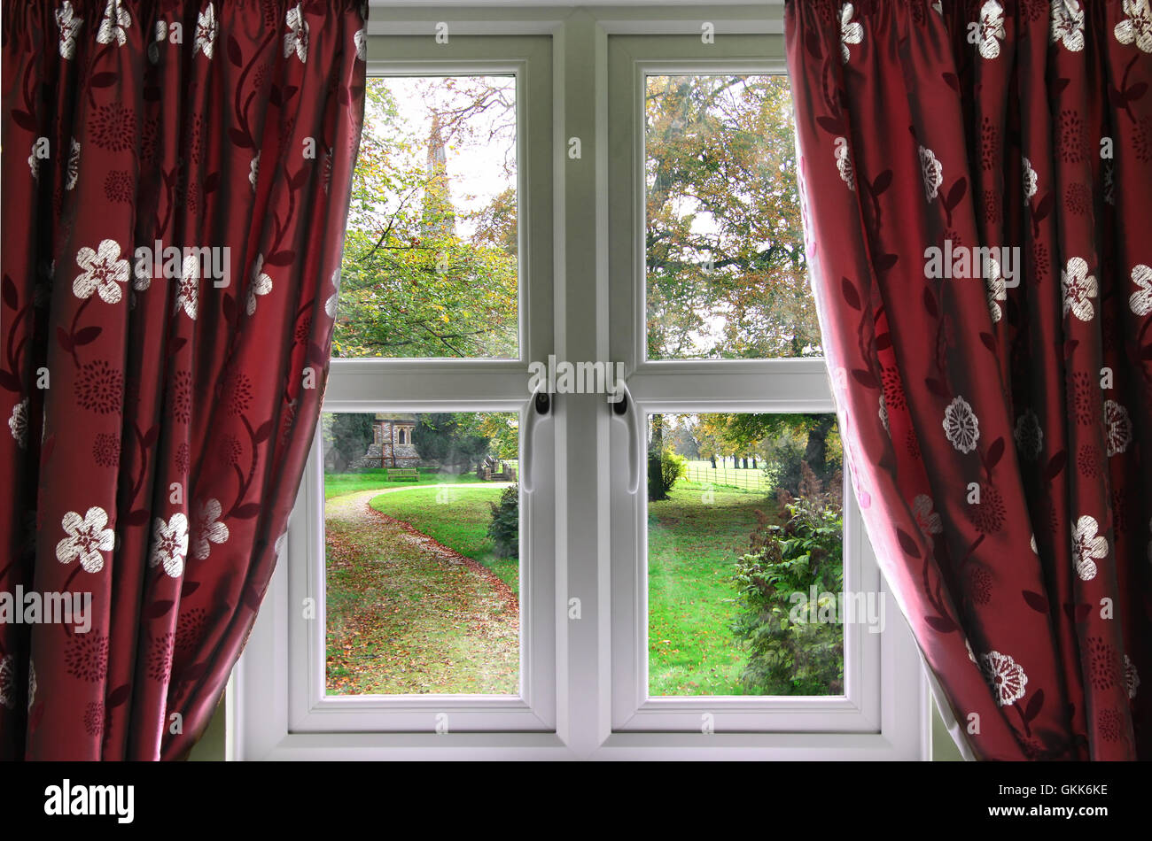 Window with curtains on to a garden Stock Photo - Alamy