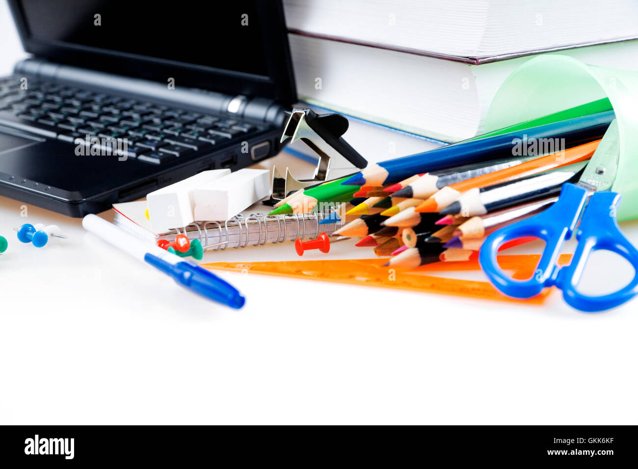 office tools and laptop on white background Stock Photo - Alamy