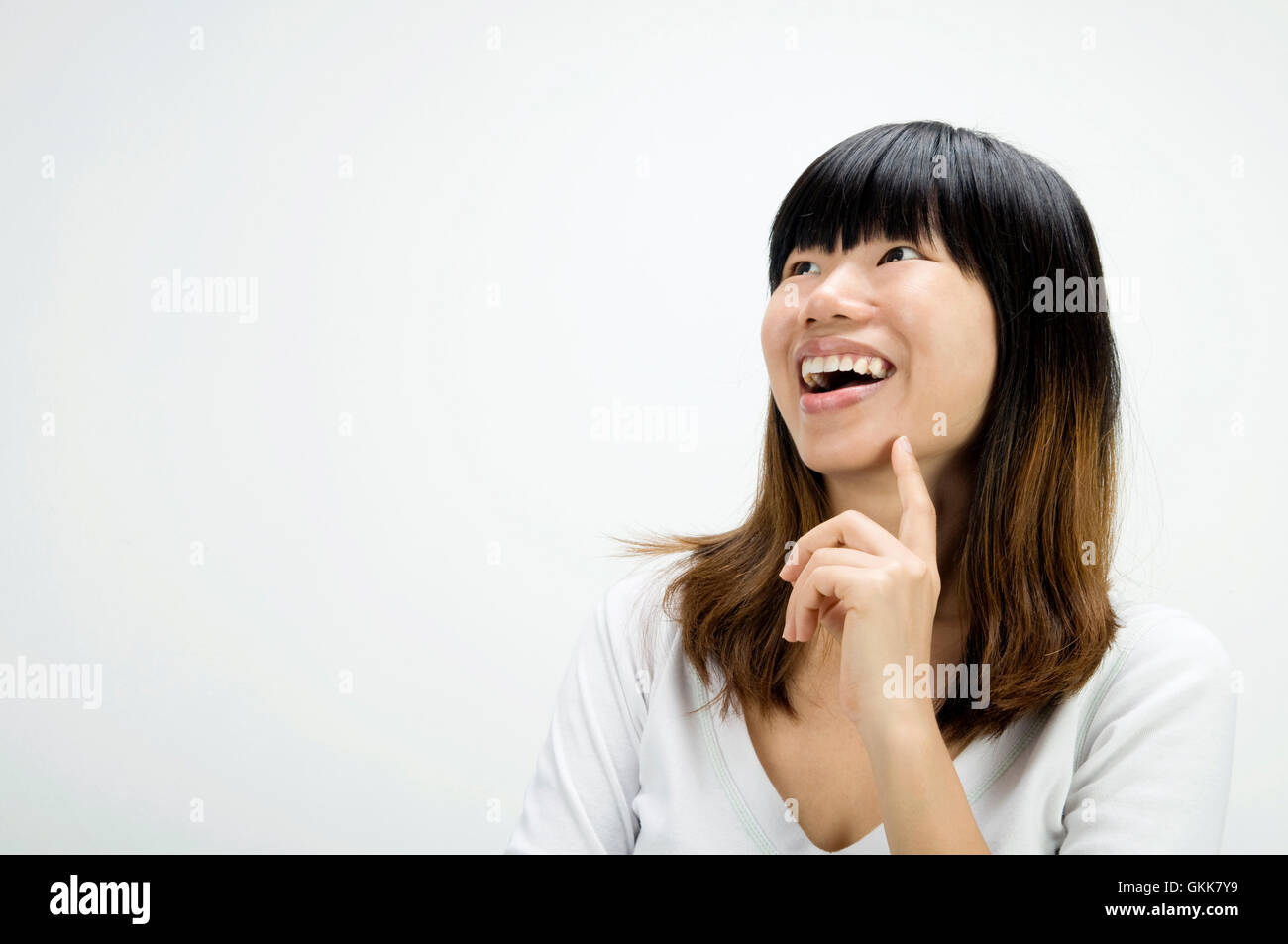 asian girl having a thought Stock Photo - Alamy