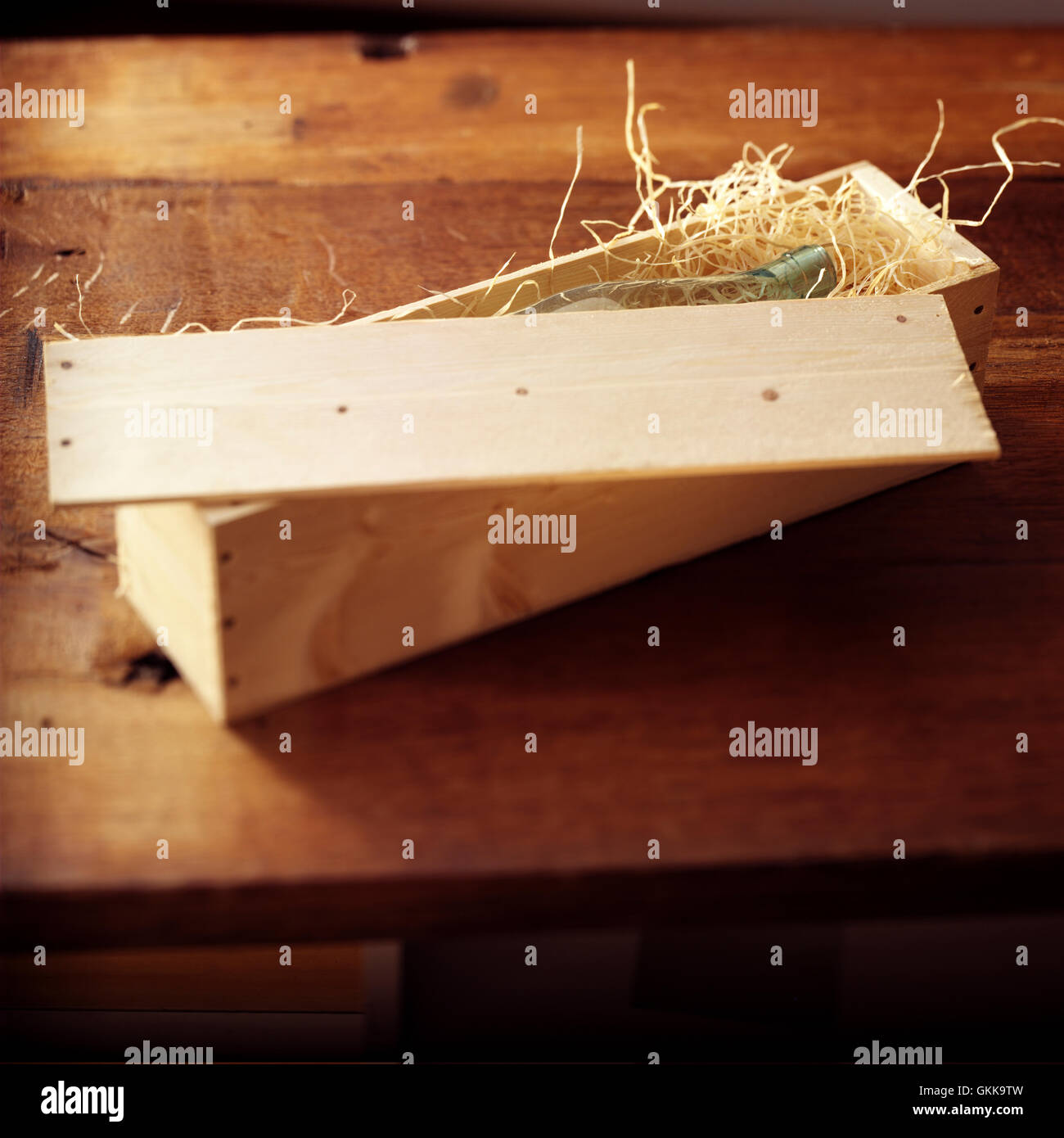 Bottle in a box Stock Photo - Alamy