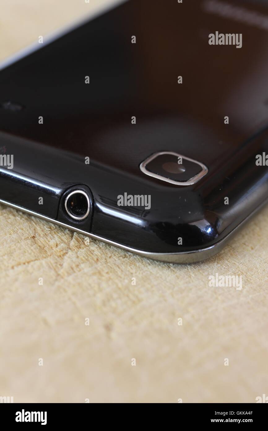 smartphone headphone cable entrance Stock Photo - Alamy
