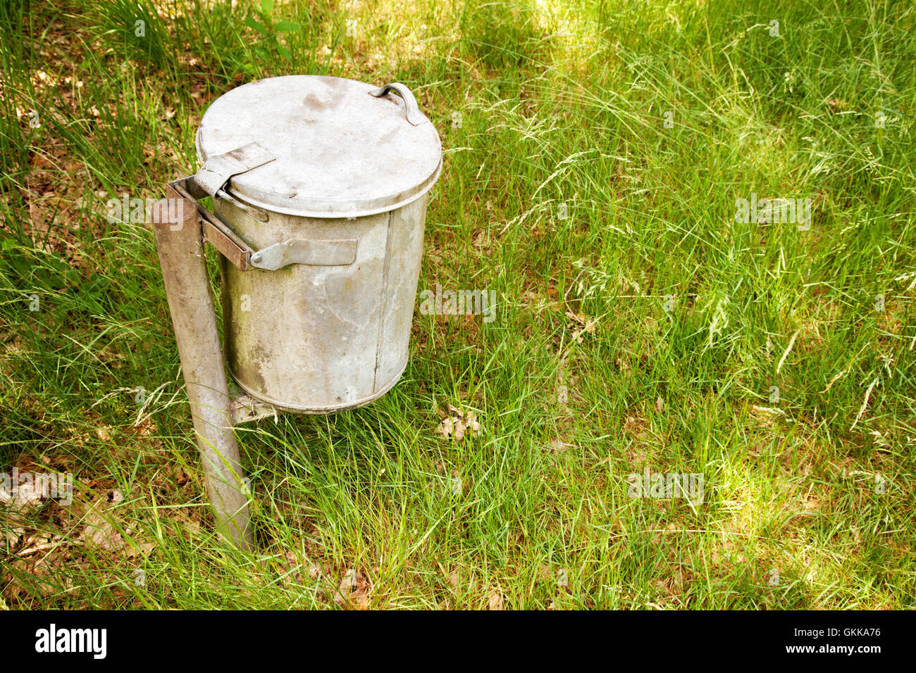 garbage bin in the grass Stock Photo - Alamy
