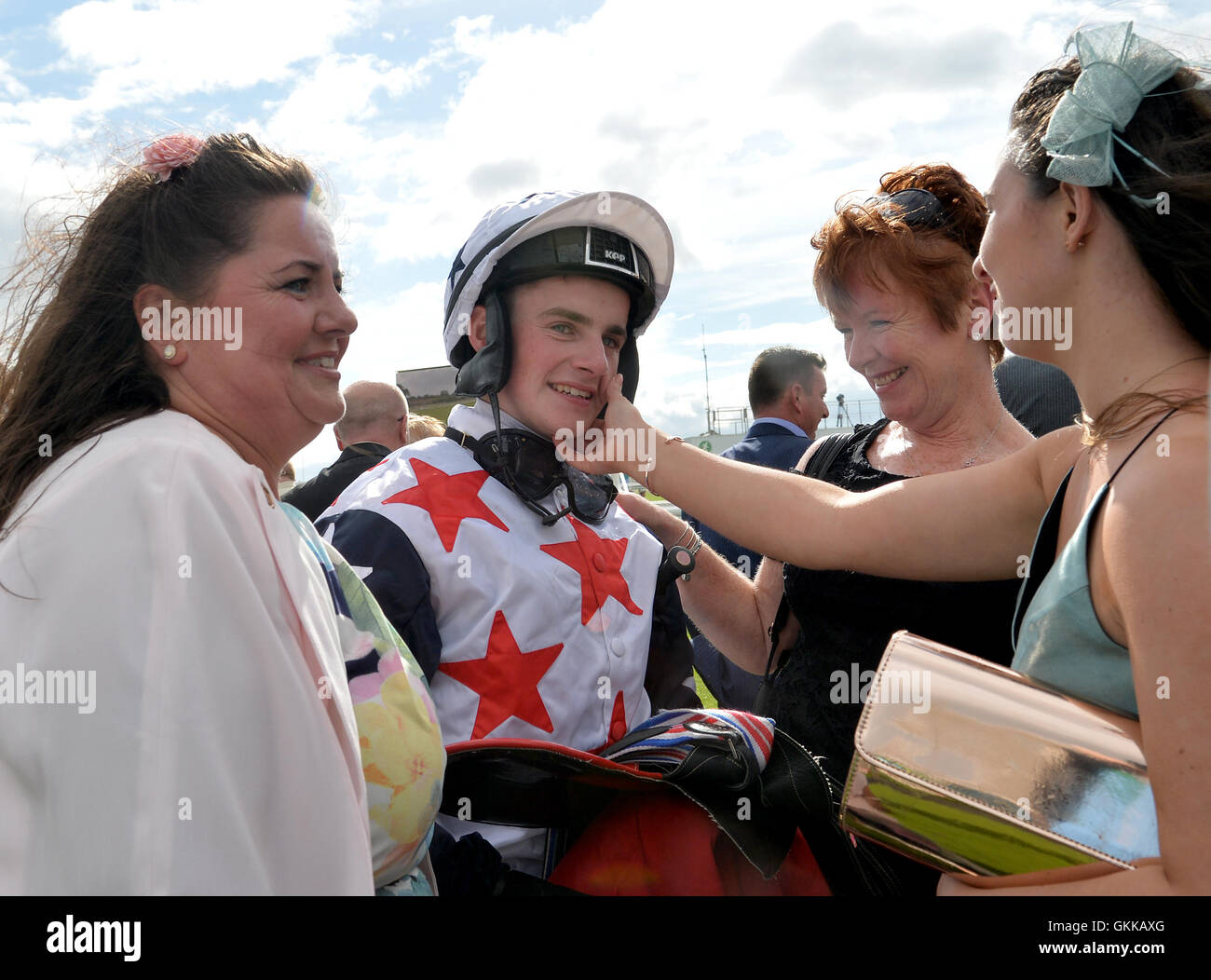 Jockey Adam McNamara is congratulated by friends after riding ...
