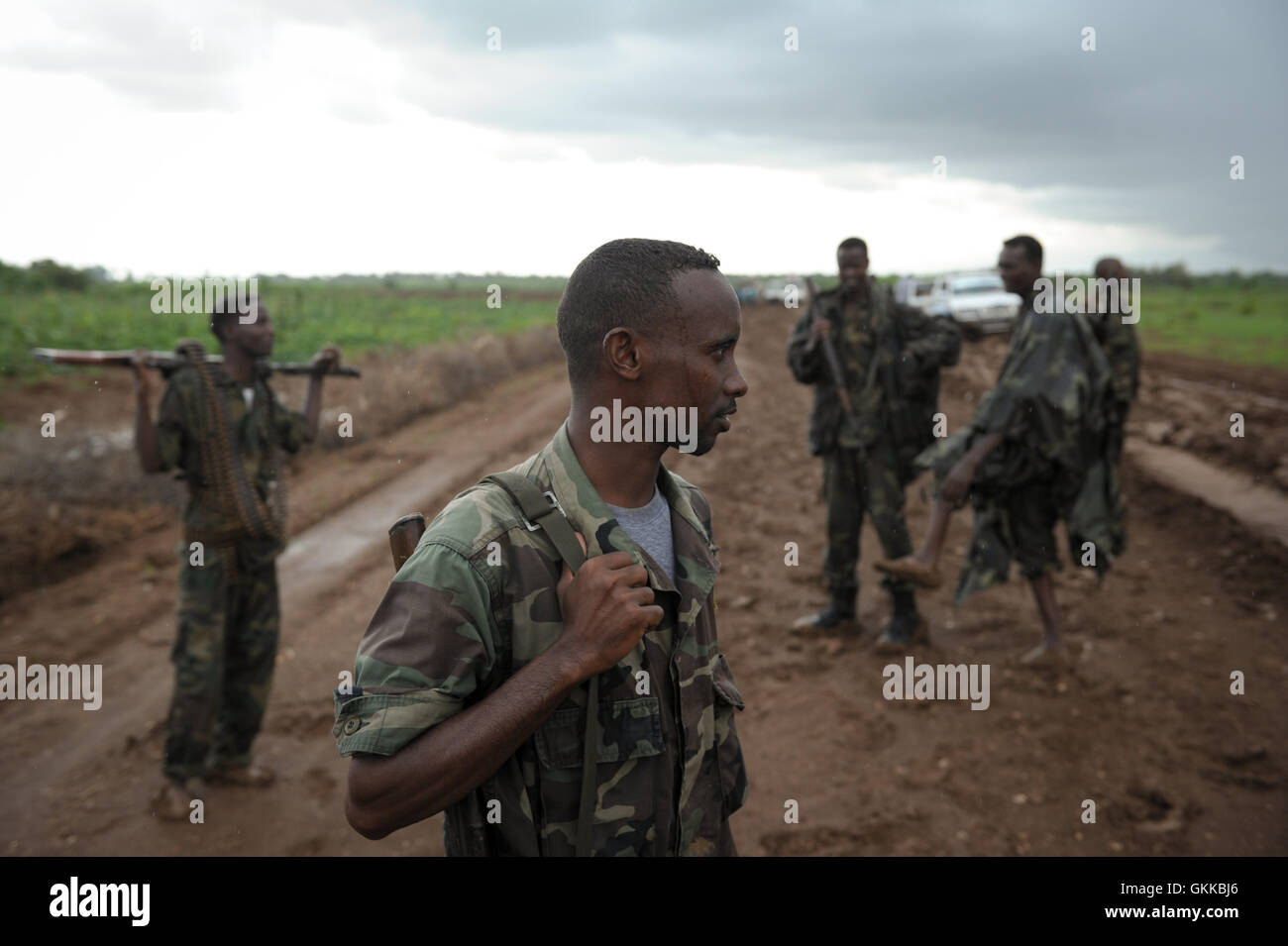 Somali National Army (SNA) soldiers stand in the rain during a storm in ...