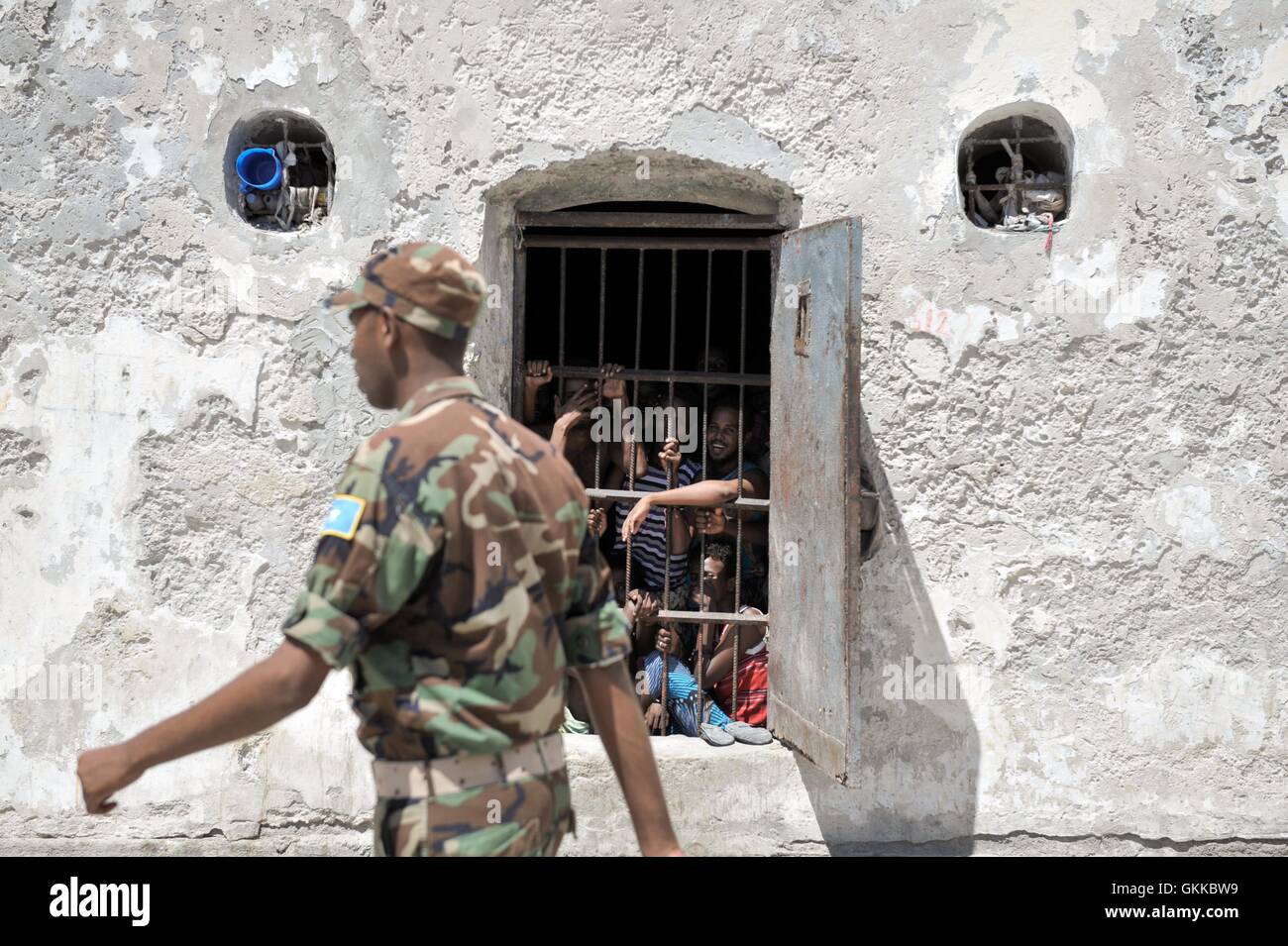 On Human Rights Day, December 10, a prison guard passes by a cell in ...