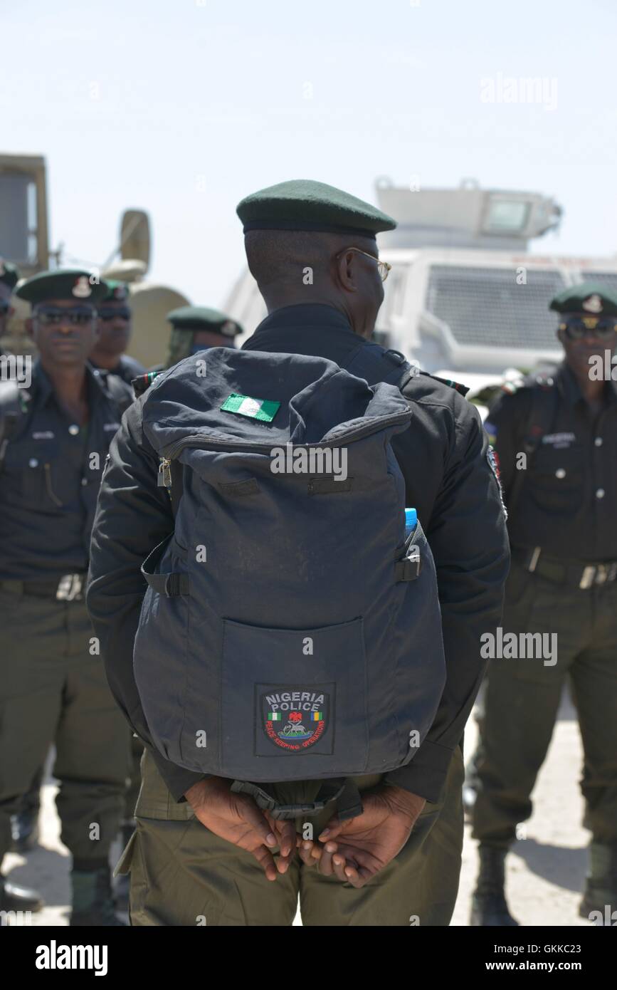 An officer from the Nigeria Formed Police Unit addresses the new team ...