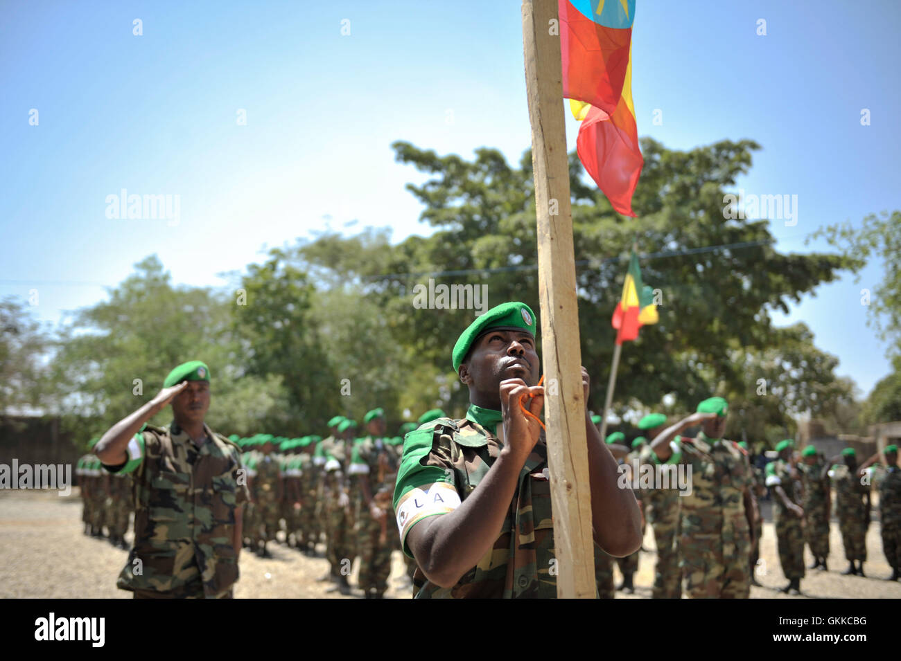 A soldier from the African Union Mission in Somalia raises the ...