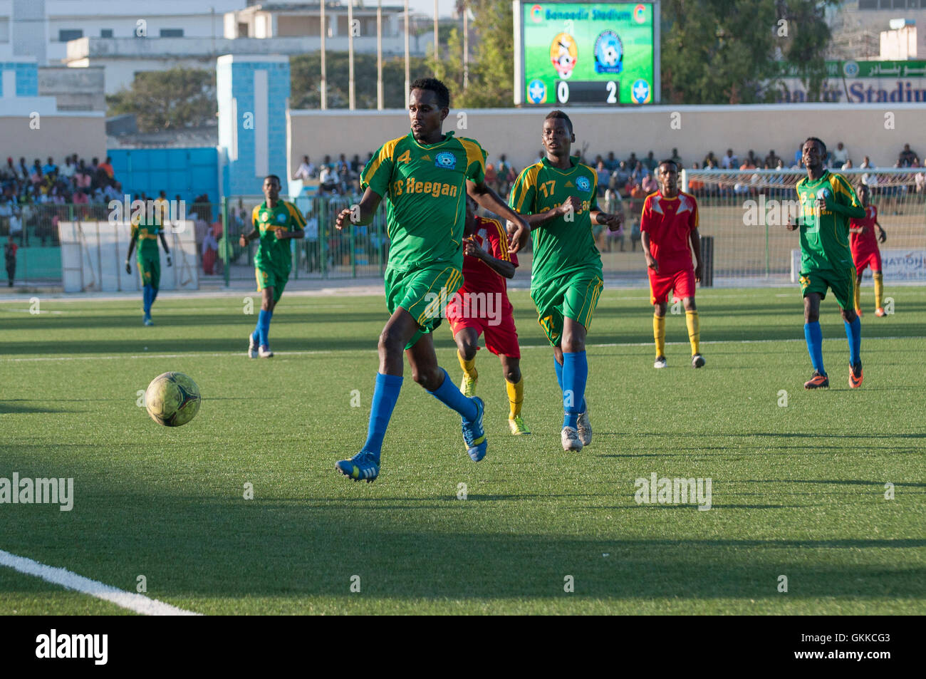 A player from Heegan FC attempts to reach the ball during a match ...