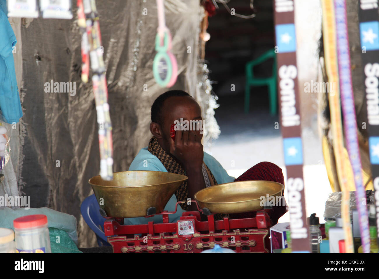 A shopkeeper in Hudur, the capital city of Bakol in Somalia, is ...