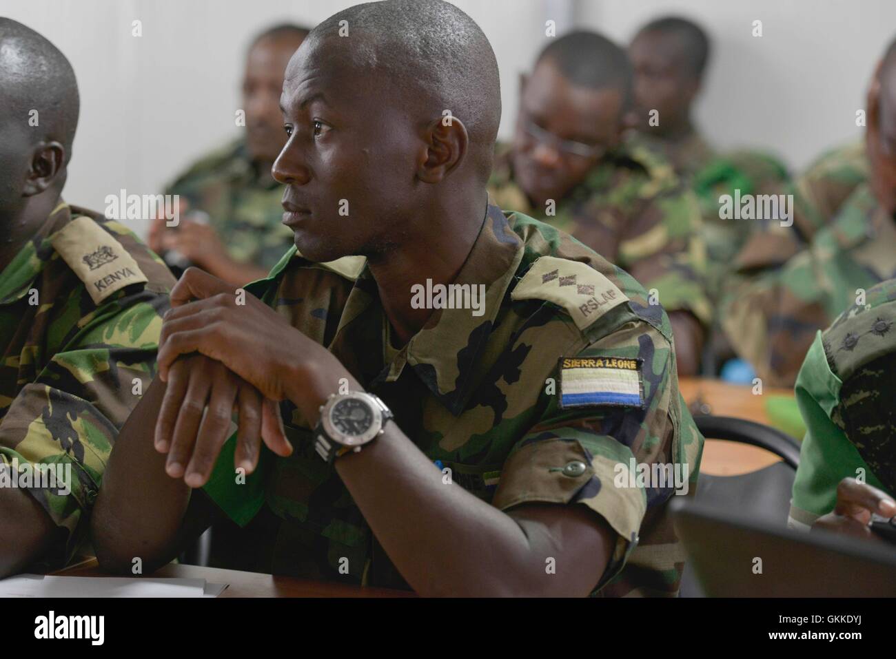 A Sierra Leoneian CIMIC officer listens to Lt. Alice Nabafu from Sector ...