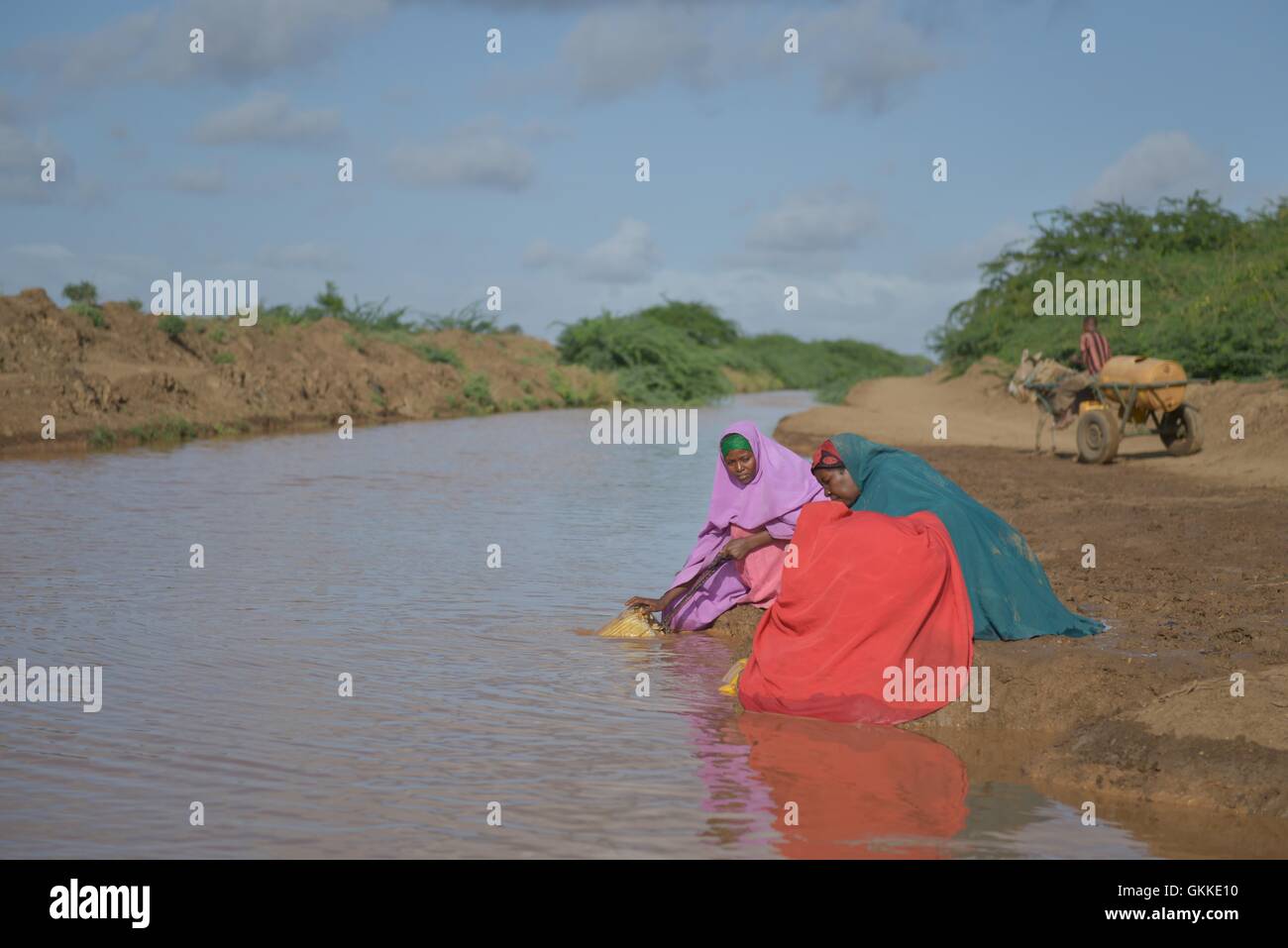 On April 29, women in Qoryooley, Somalia, collected water from the ...