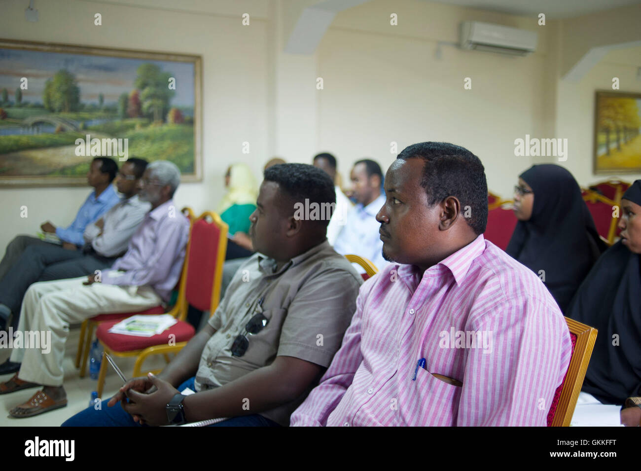 Attendants listen to MRC Manager, Harbi Jama, during the launch of ...