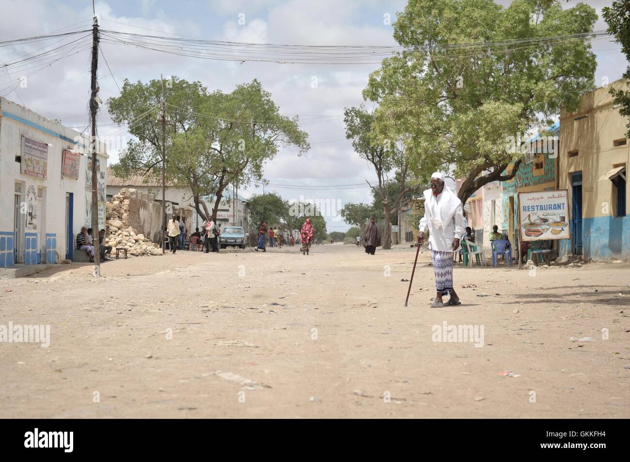 An elderly Somali man crosses the road in Bulo Burte, Somalia on August ...