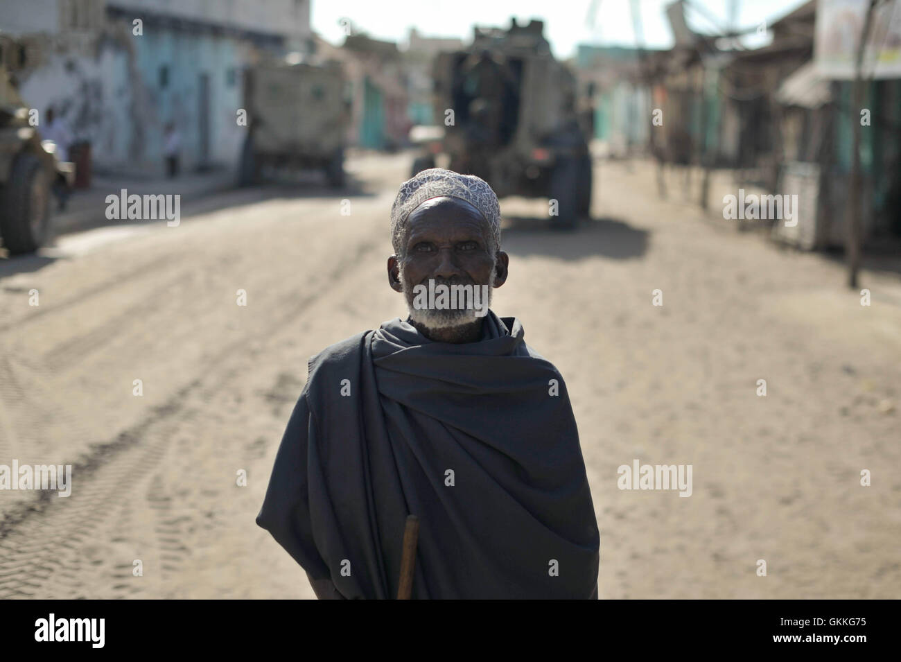 An elder walks through the center of Barawe in the Lower Shabelle ...