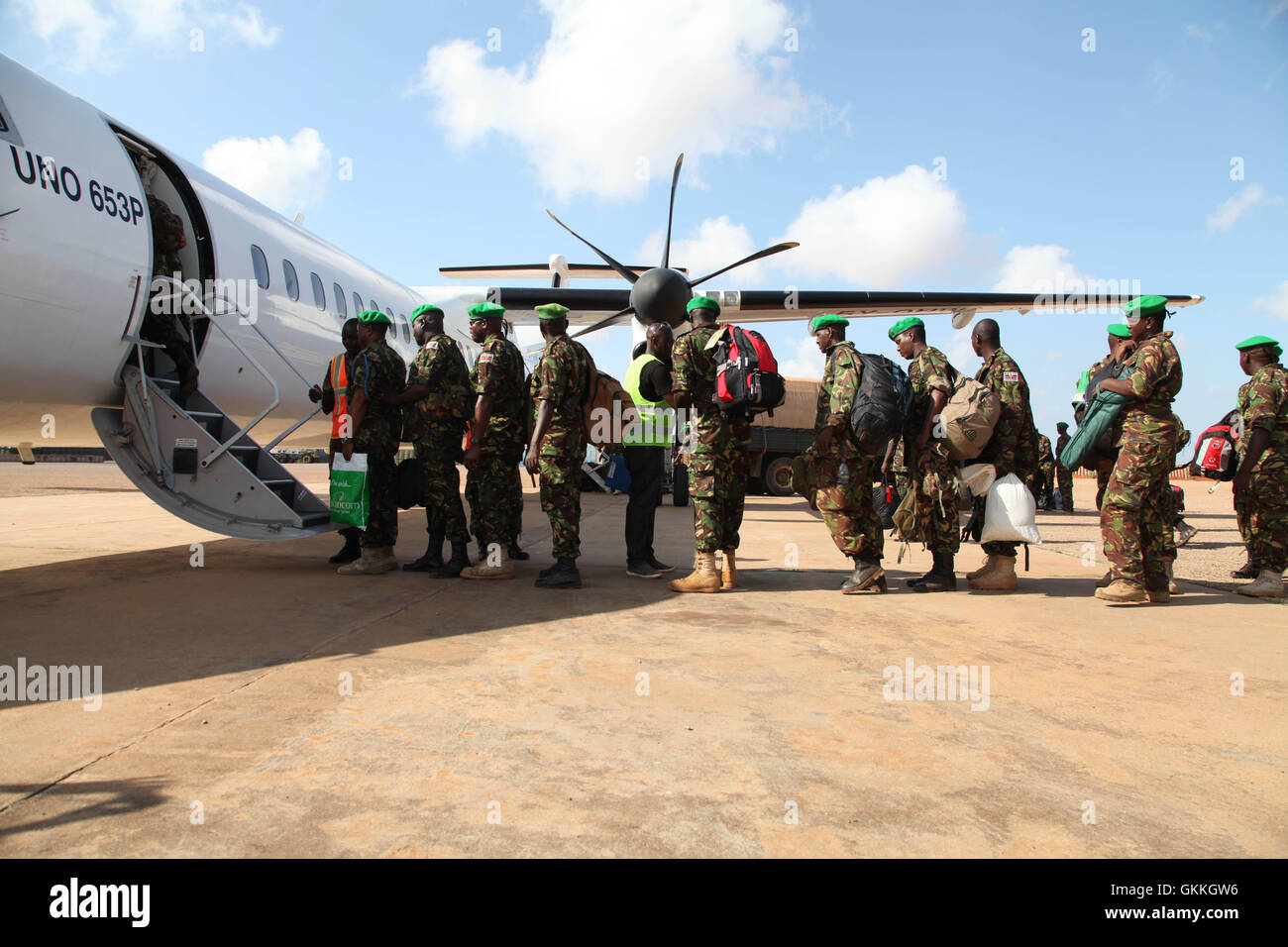 Kenya Defence Forces (KDF) troops prepare to board a plane on December 9 after completing their ...