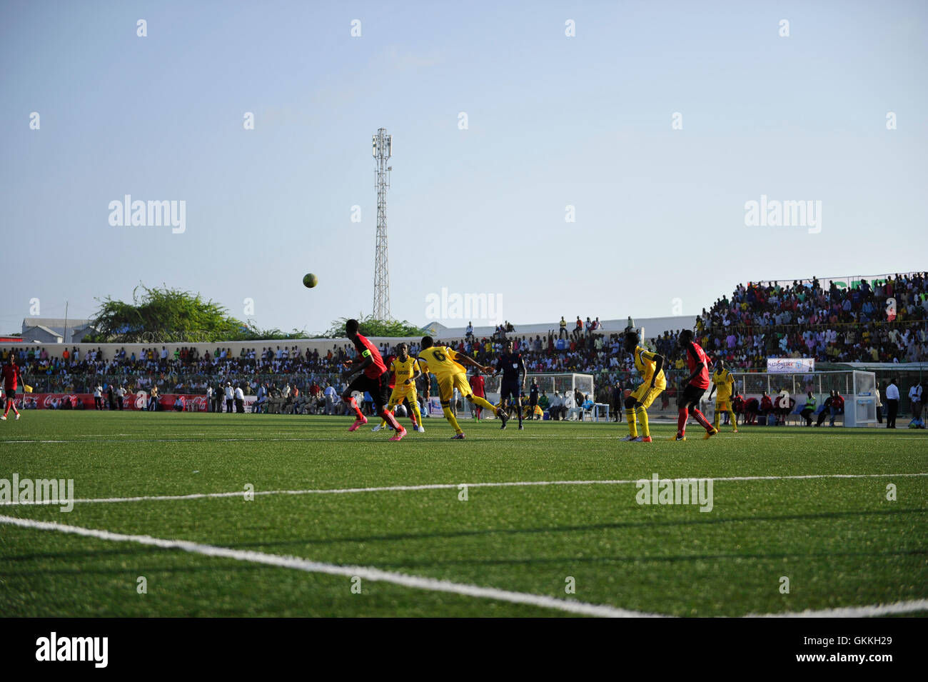 Players compete for the ball during a Somali Premier League match ...