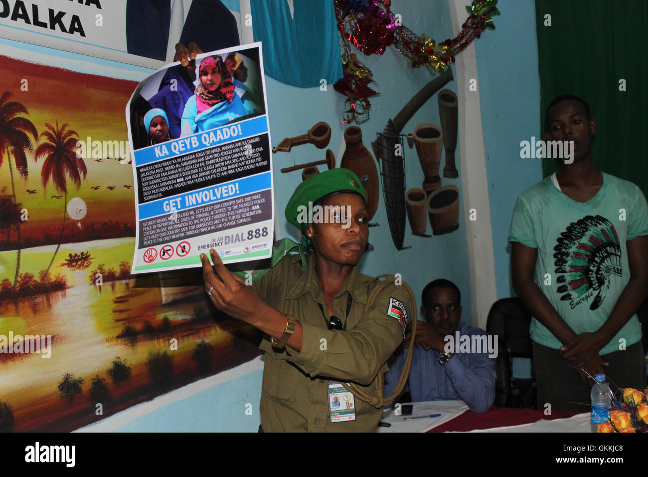 An AMISOM Police officer addresses residents in Hodan district ...
