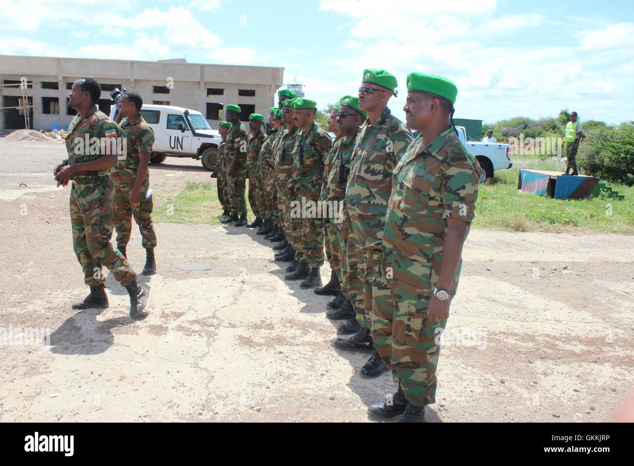 AMISOM military officers stand at attention to receive the United ...