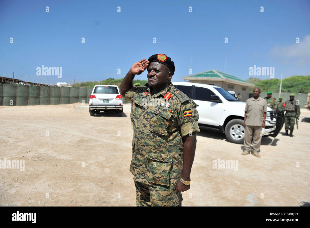 Uganda's Chief of Defence Forces, General Katumba Wamala, salutes ...