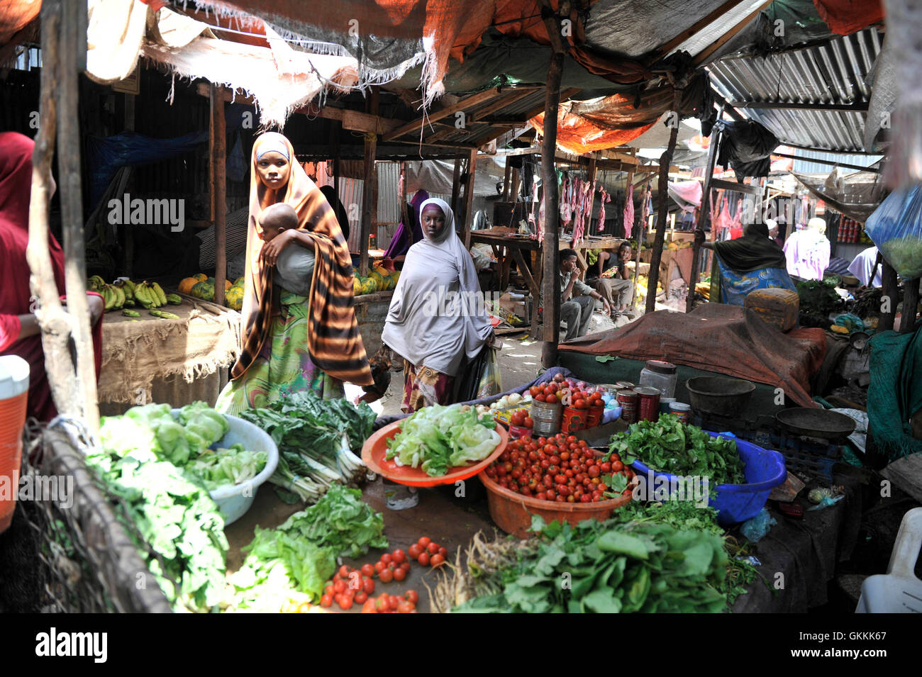 On June 16, 2015, Somali women were seen walking past fresh vegetable ...