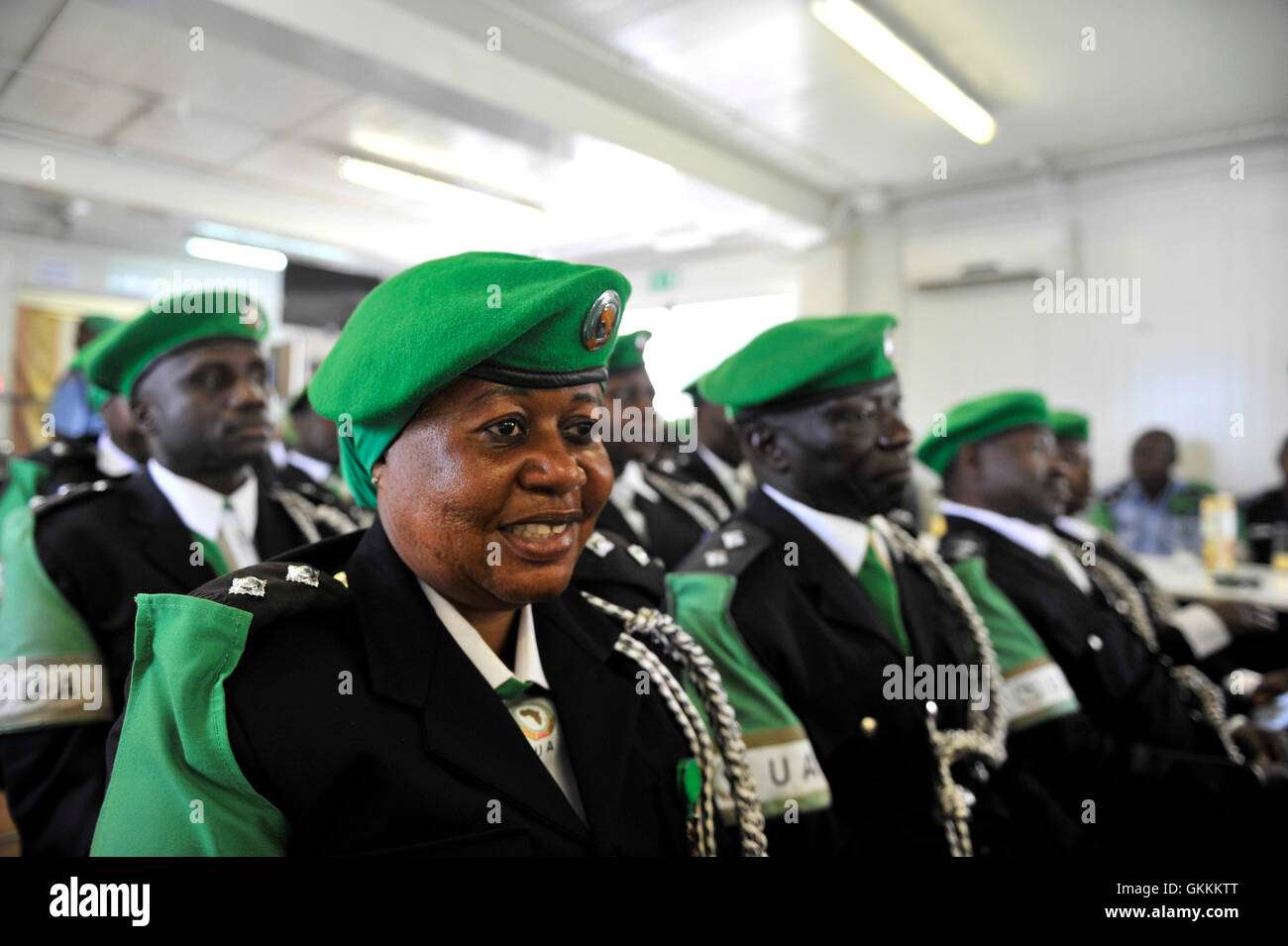 Ugandan Police officers serving with AMISOM attend a farewell ceremony ...