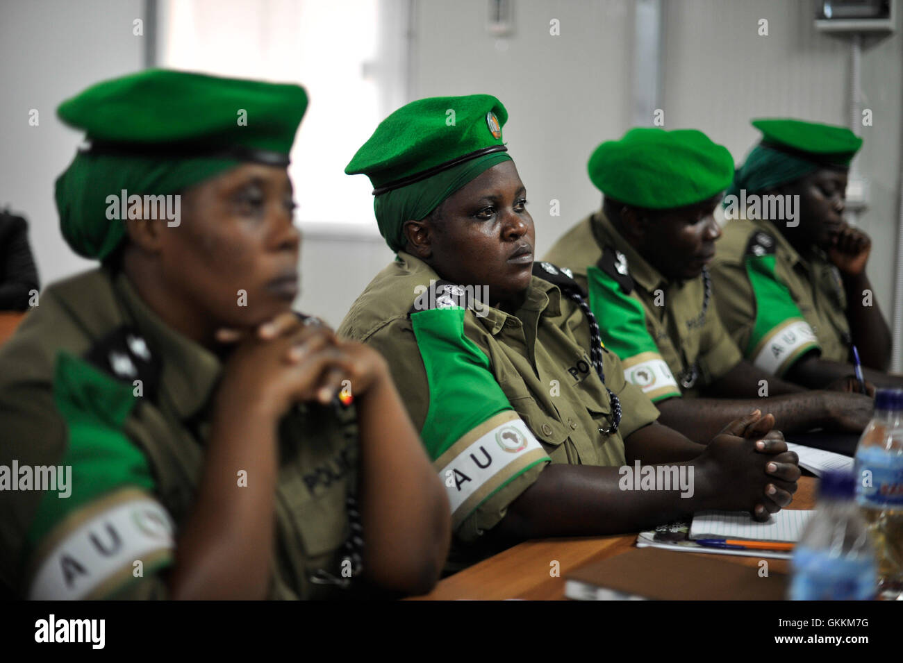Newly deployed Ugandan Police officers under AMISOM listen to speeches ...