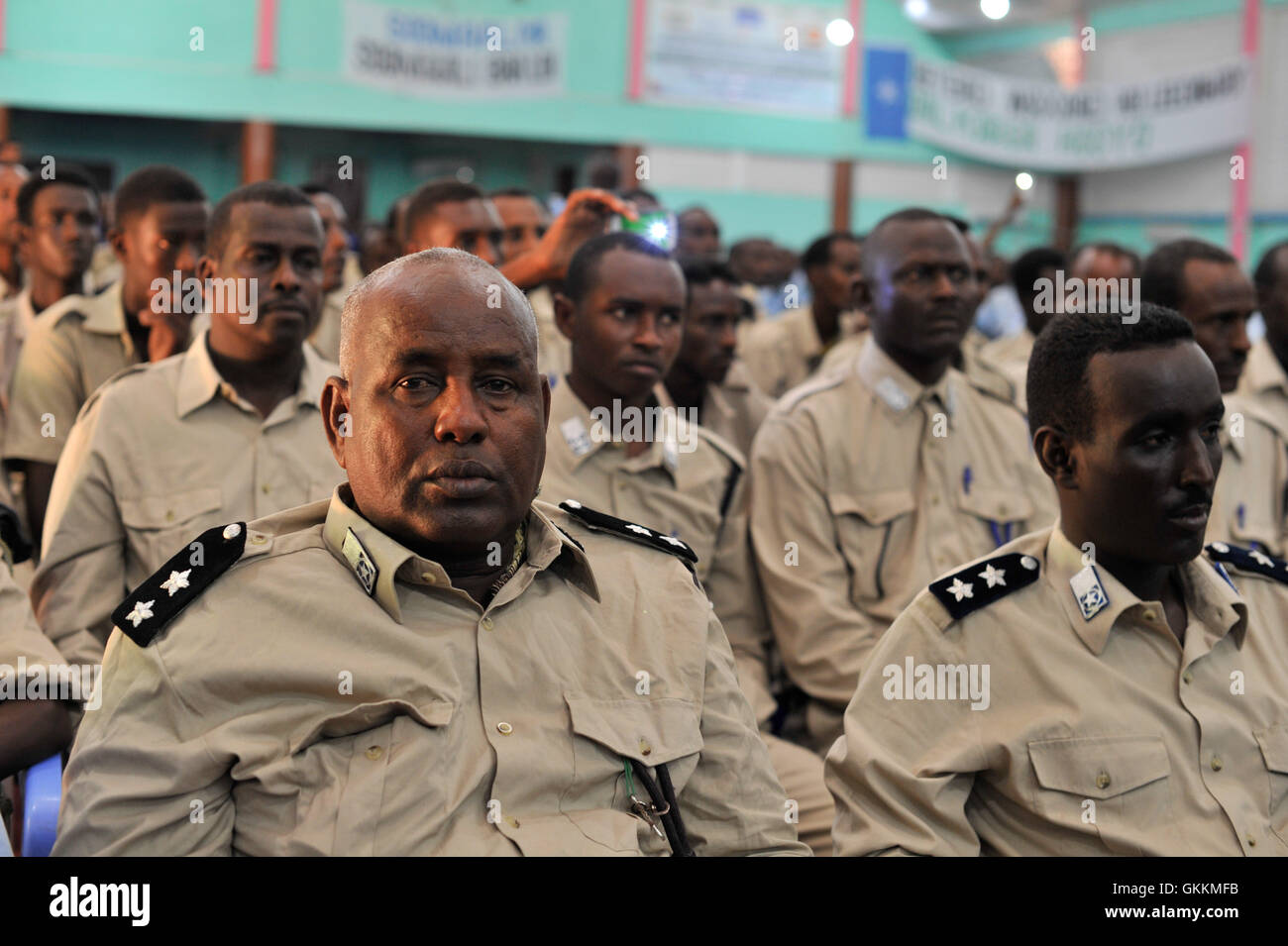 Newly trained Somali police officers attend the closing ceremony of a ...