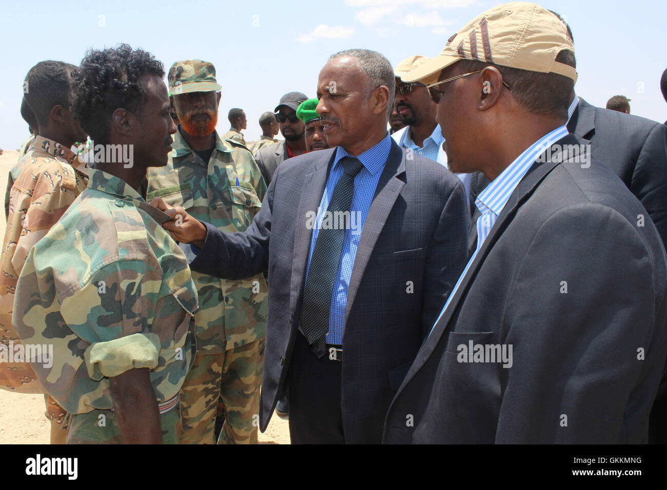 Somalia’s Minister of Defence, Abdikadir Sheikh Ali Diini, inspects the ...