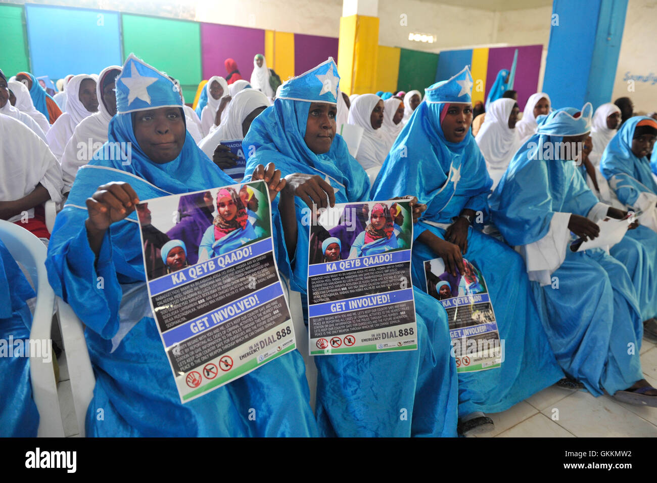 Somali women display community policing posters at a town hall meeting ...