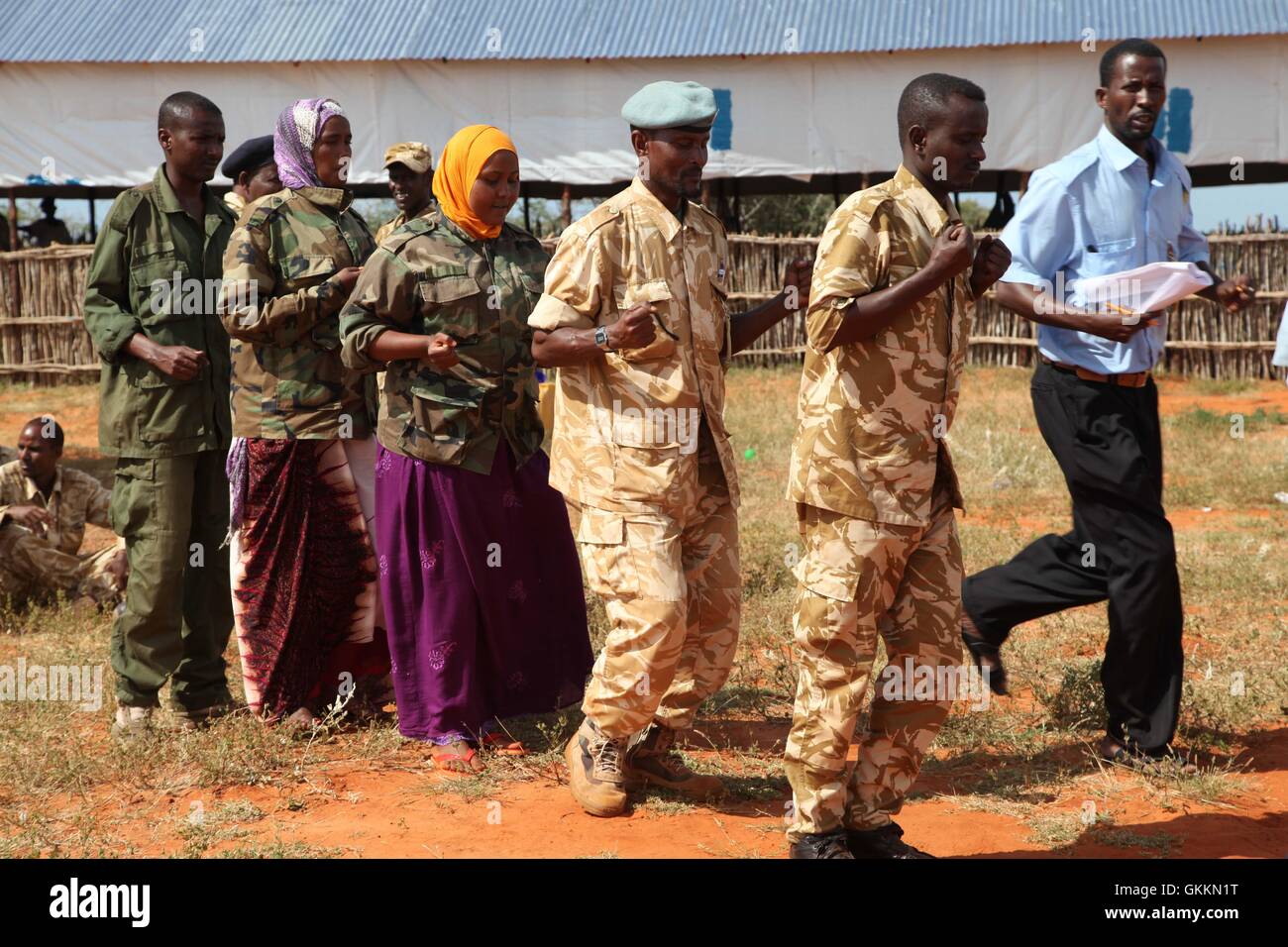 Fresh Somali Police Force (SPF) recruits queue for screening during a ...