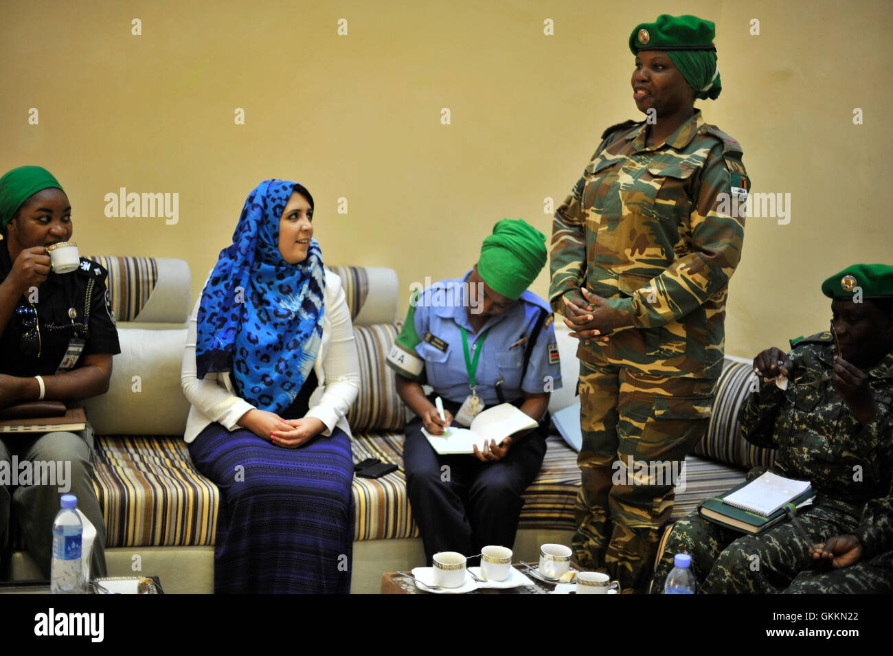An AMISOM Police Officer speaks with Somalia's First Lady Sahra Omar ...