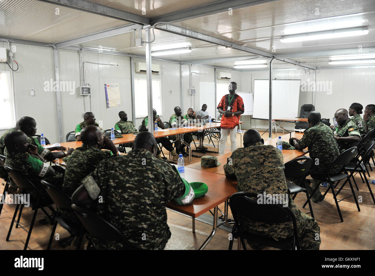 A facilitator explains a point during a three day training on Child ...