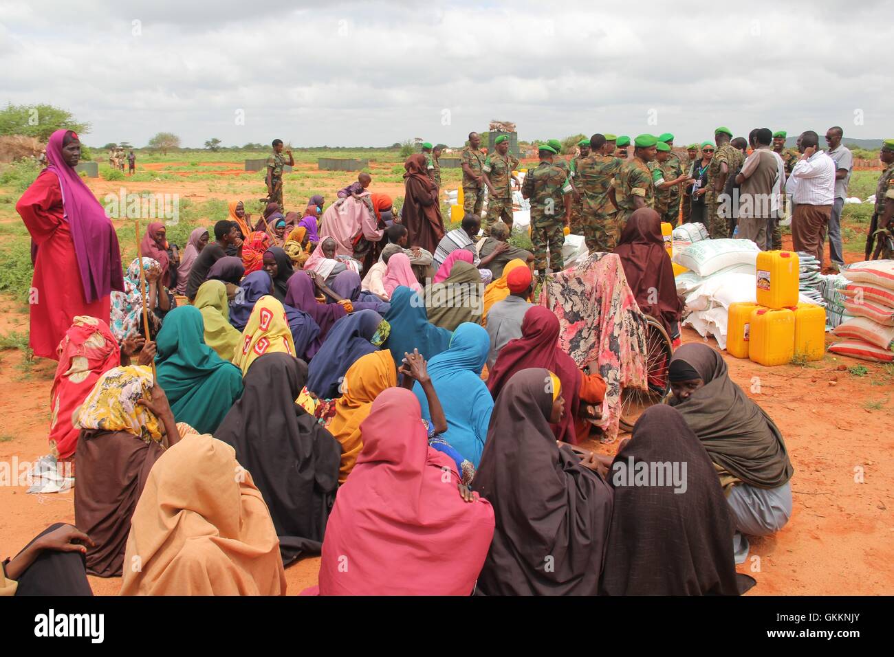 Residents of Diinsoor, in Bay region, Somalia, await relief food at a ...