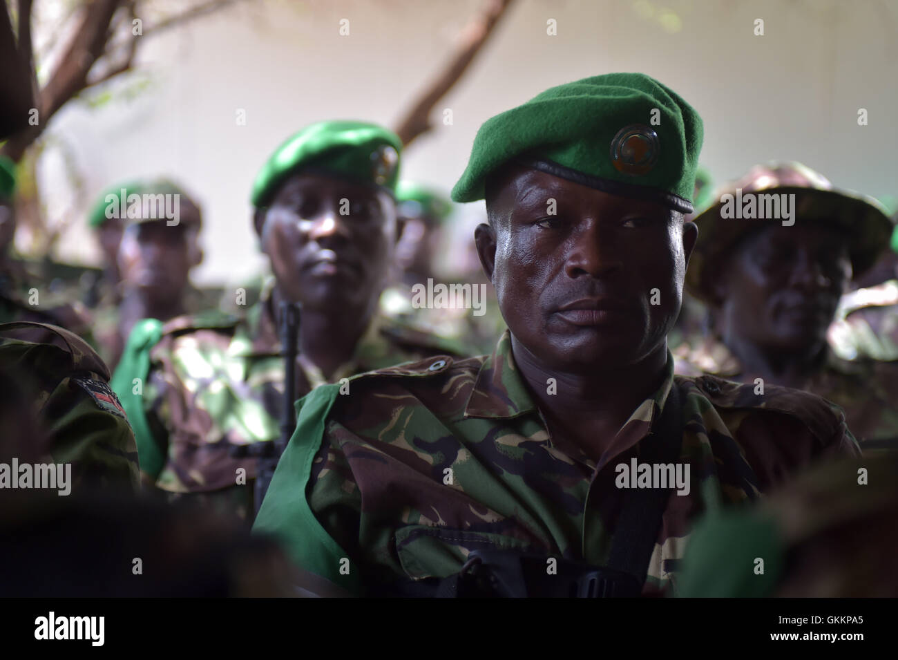 Soldiers of the African Union Mission in Somalia (AMISOM) listen to ...