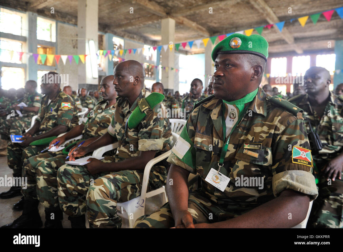 Burundian troops serving under AMISOM listen attentively to a speech by ...