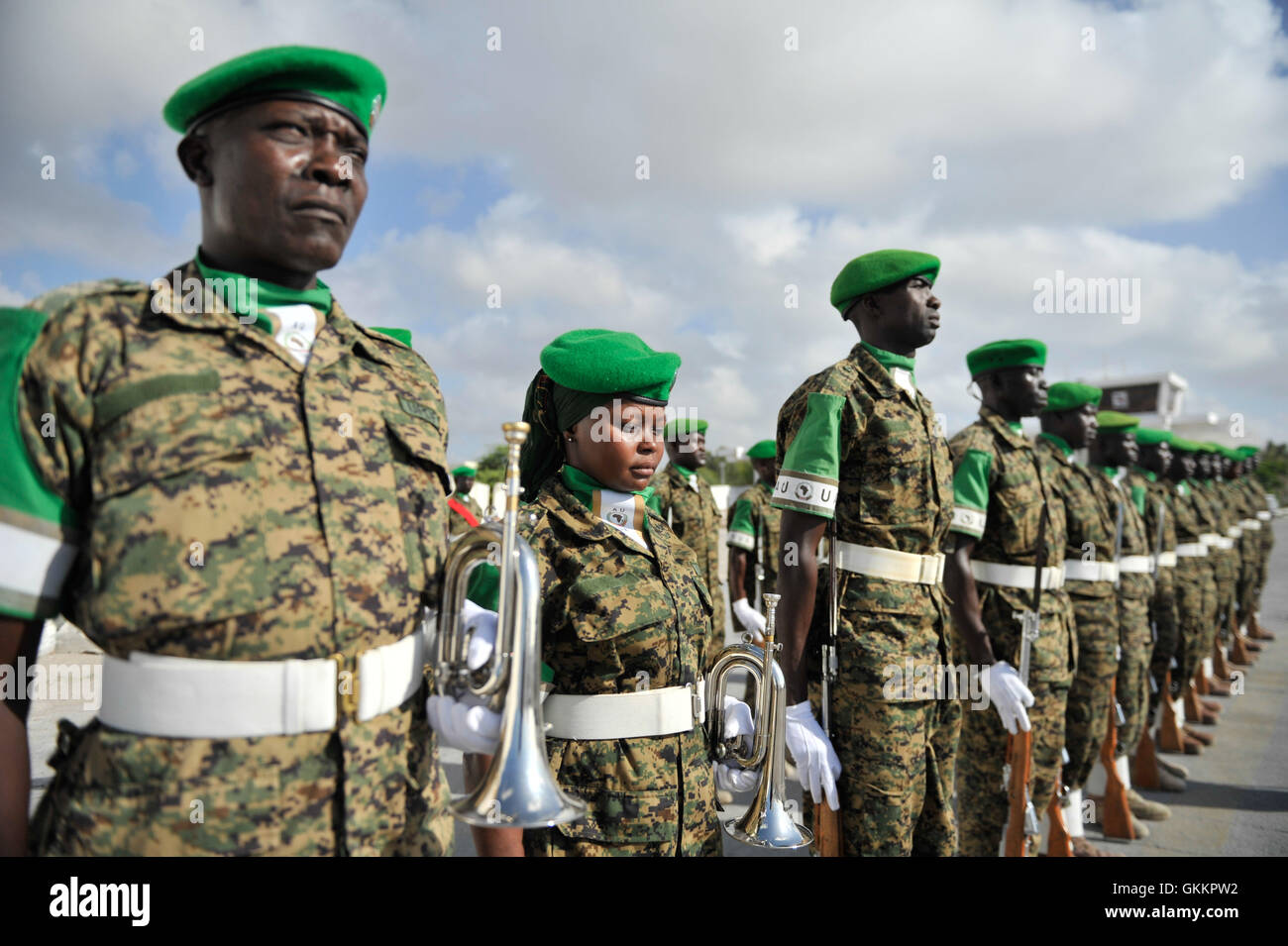 African Union soldiers mount a guard of honour to mark the departure of ...