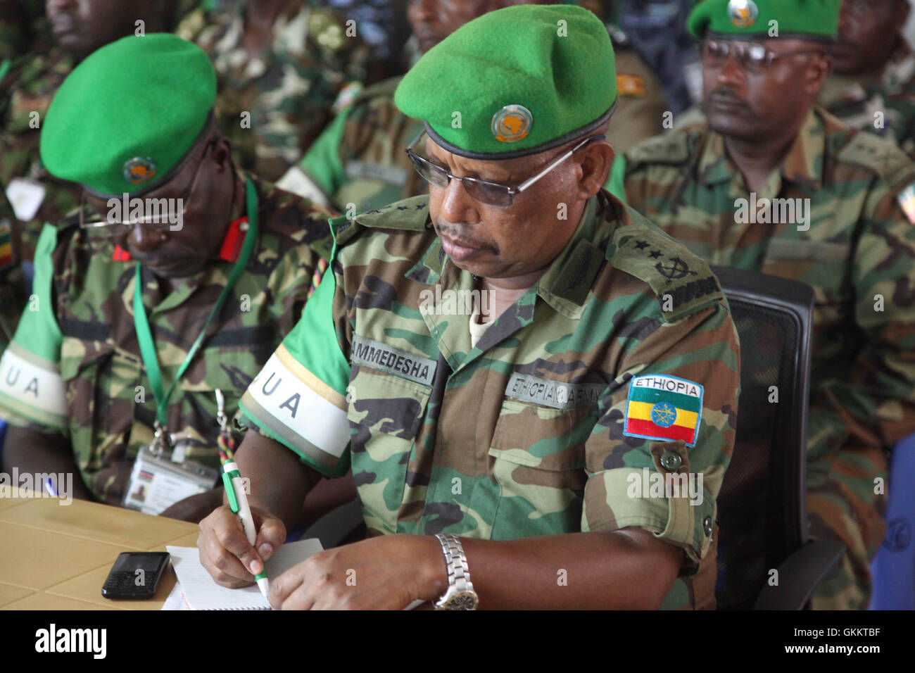AMISOM Force Commander Major General Mohammedesha Zeyinu takes notes ...
