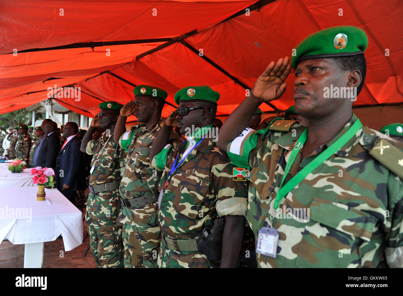 Burundian soldiers serving with AMISOM salute during a medal ceremony ...