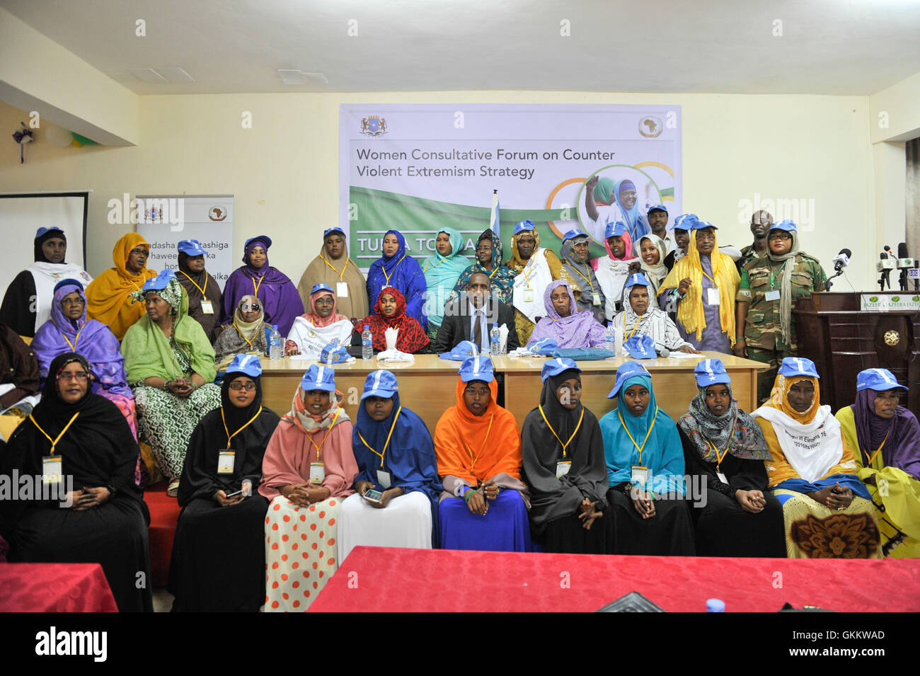 Participants pose for a group photo at the Women's Consultative Forum ...