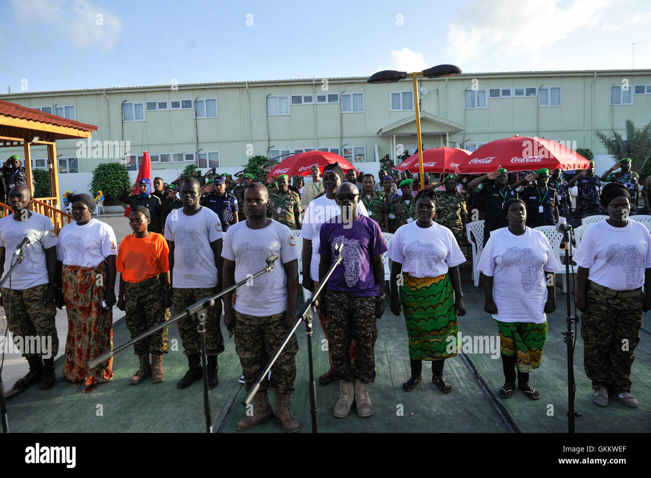 Guests stand for the Somali national anthem and AU anthem during ...