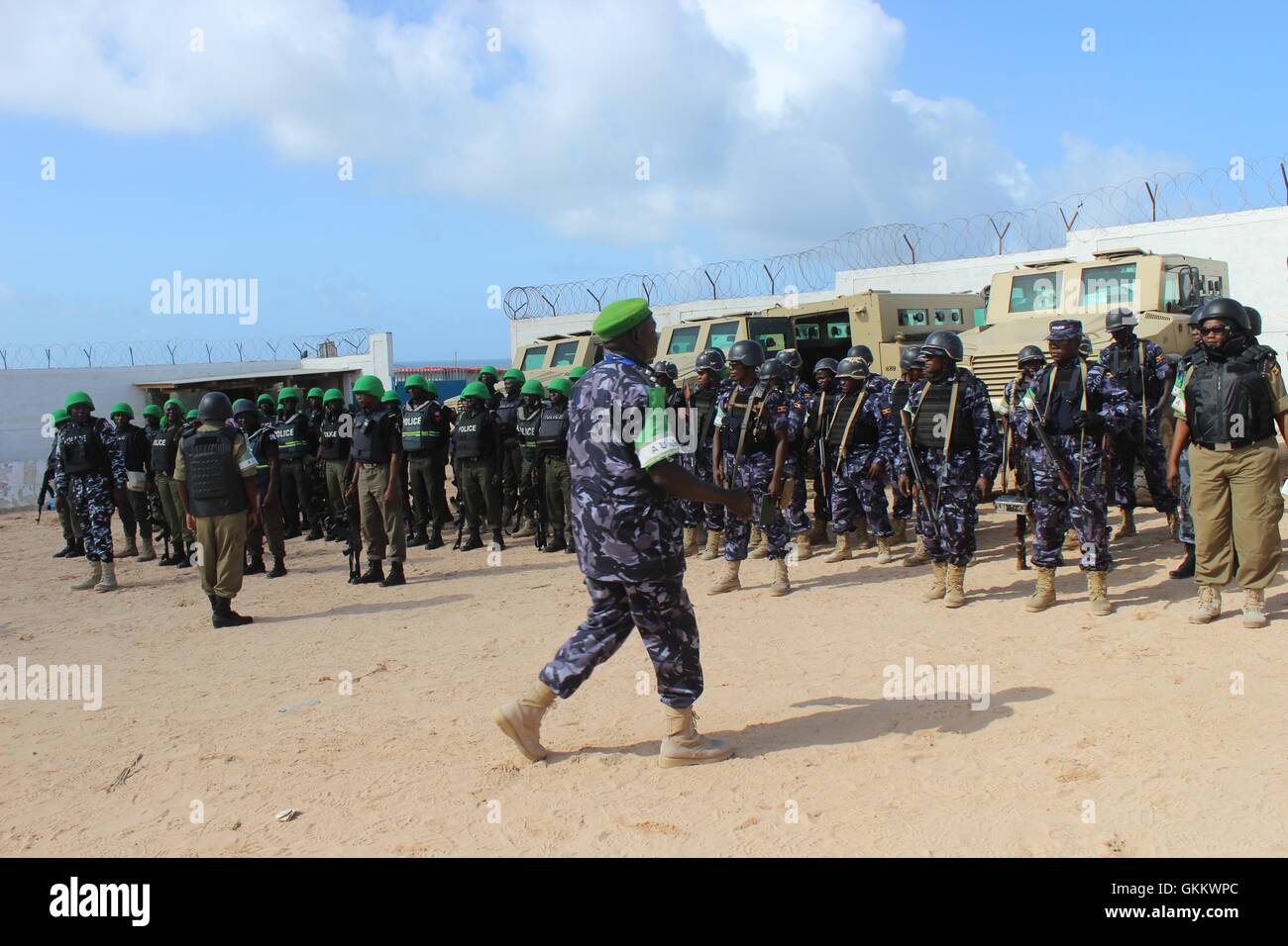 AMISOM police officers receive briefings from their commanders on June ...